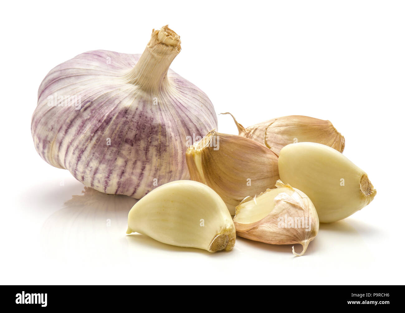 One whole garlic bulb and separated cloves isolated on white background ...