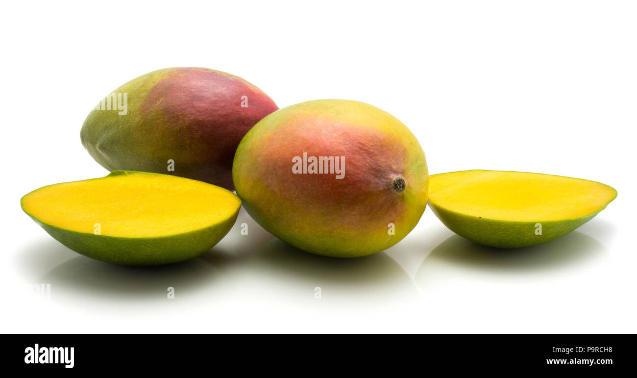 Mango isolated on white background two whole two halves Stock Photo - Alamy