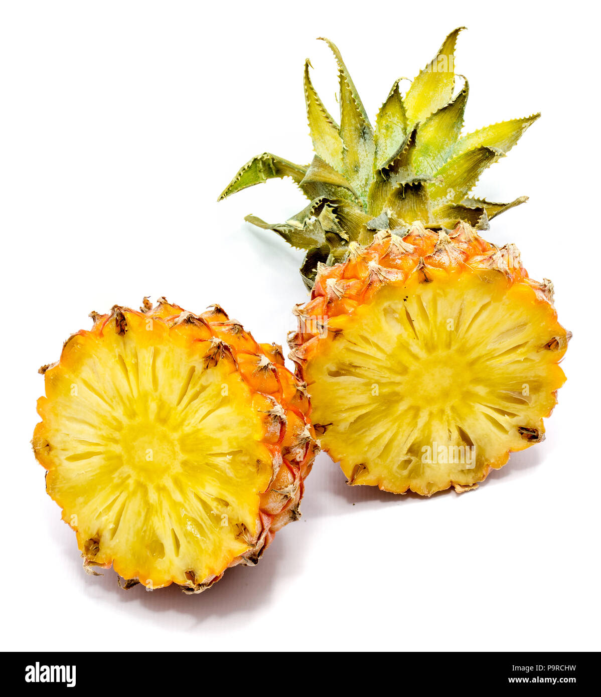 Two pineapple halves isolated on white background Stock Photo - Alamy