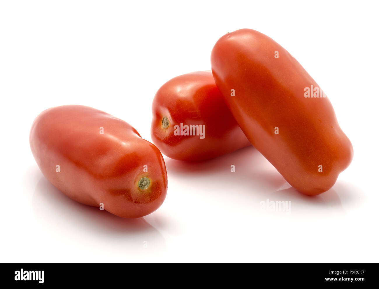 Three San Marzano tomato isolated on white background whole red ripe ...