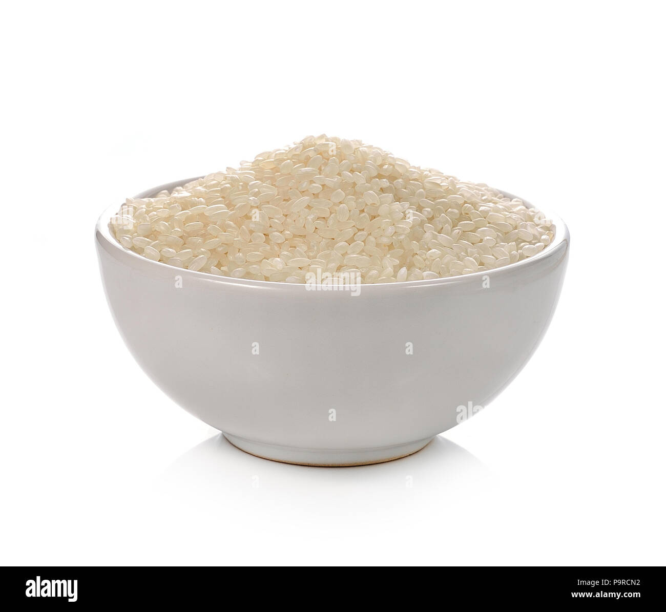 rice in a bowl isolated on white background Stock Photo - Alamy