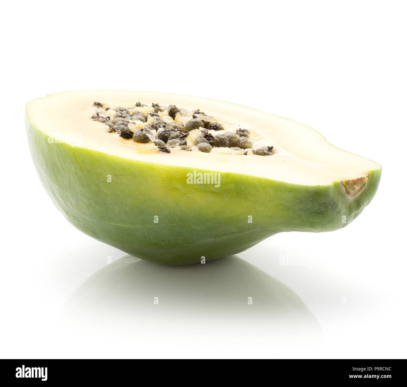 One papaya half (pawpaw, papaw) with seeds isolated on white background ...