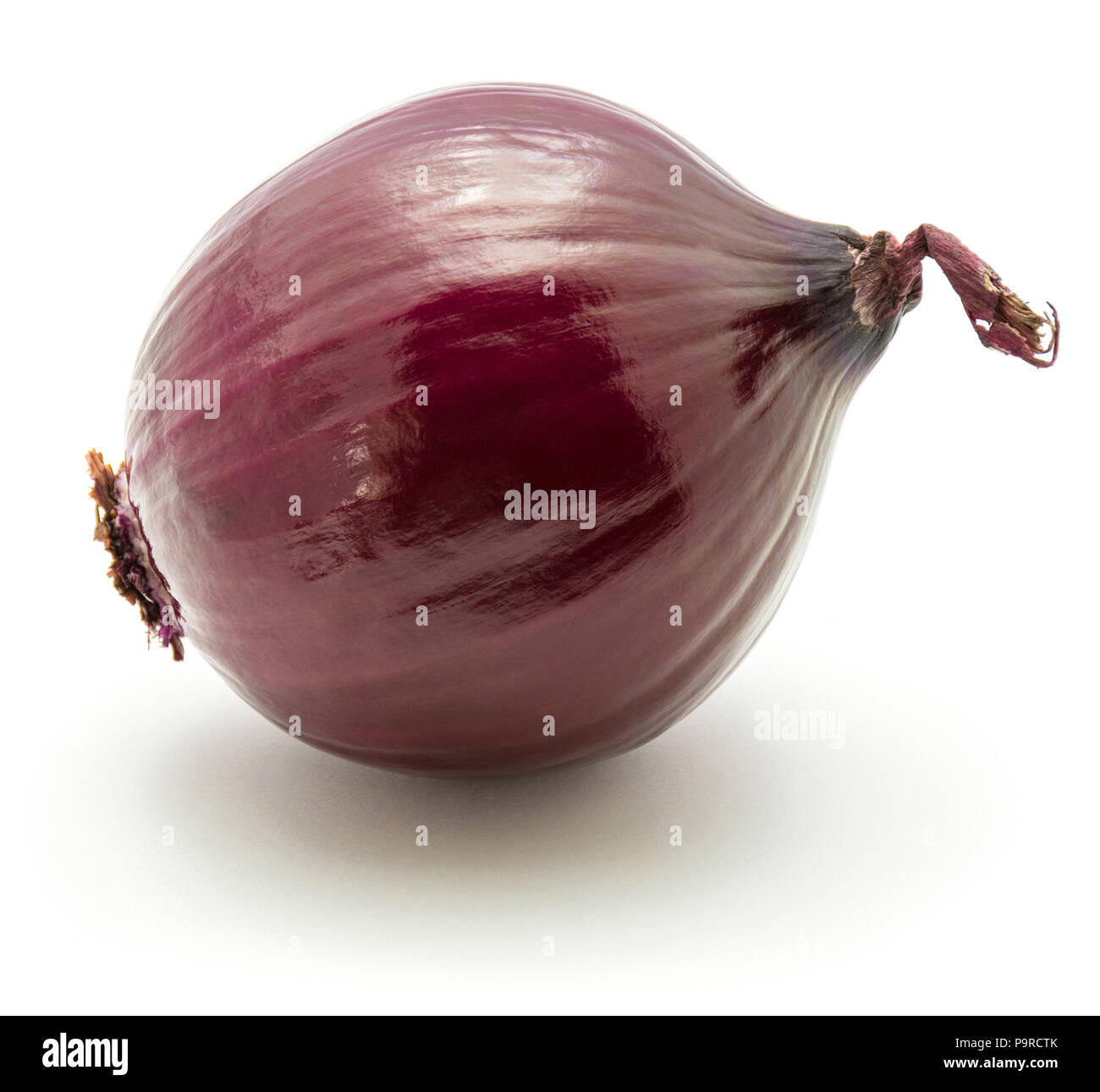 One whole peeled red onion bulb isolated on white background Stock ...