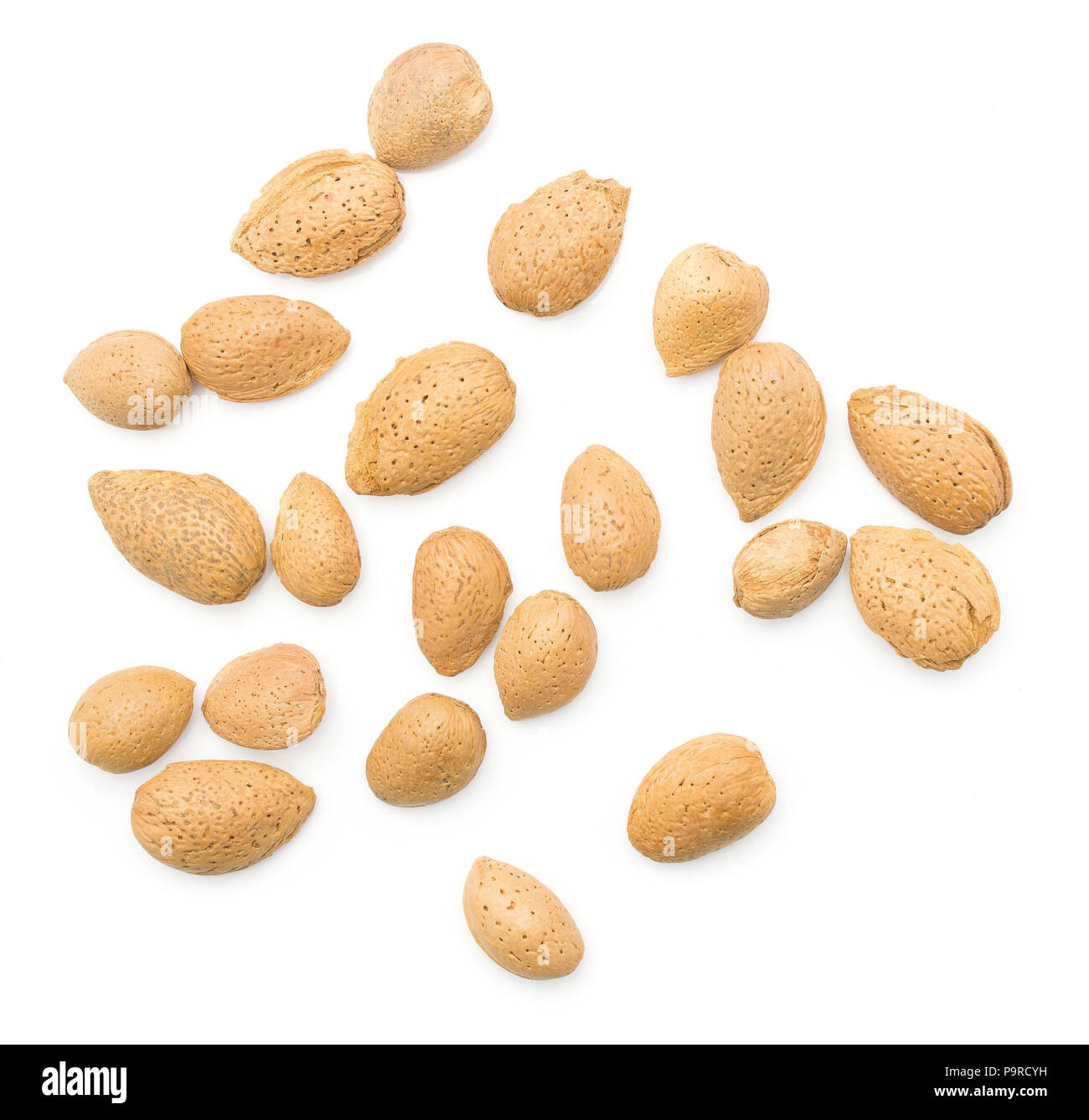 Unshelled almonds top view isolated on white background a lot of whole ...