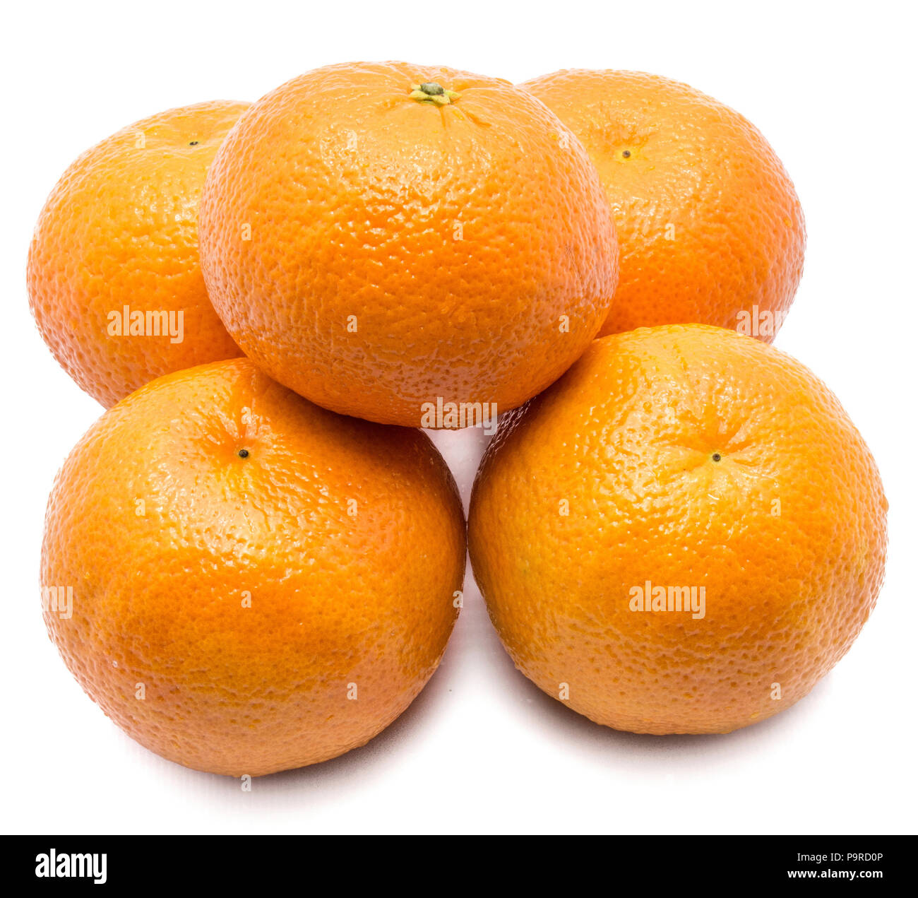 Group of five whole Clementines folded in pyramid isolated on white ...