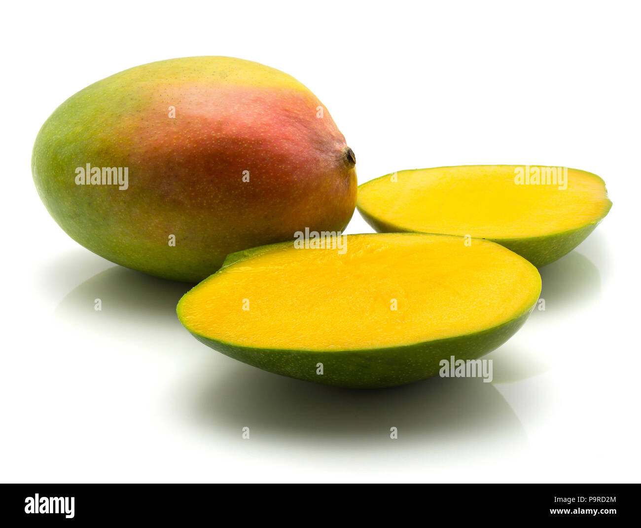 Mango isolated on white background one whole and two halves Stock Photo ...