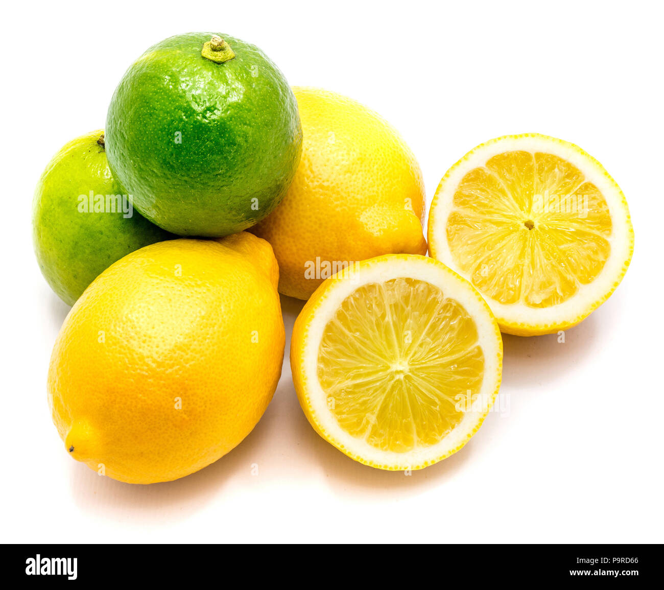 Citrus. Two whole limes, lemons and its halves isolated on white ...