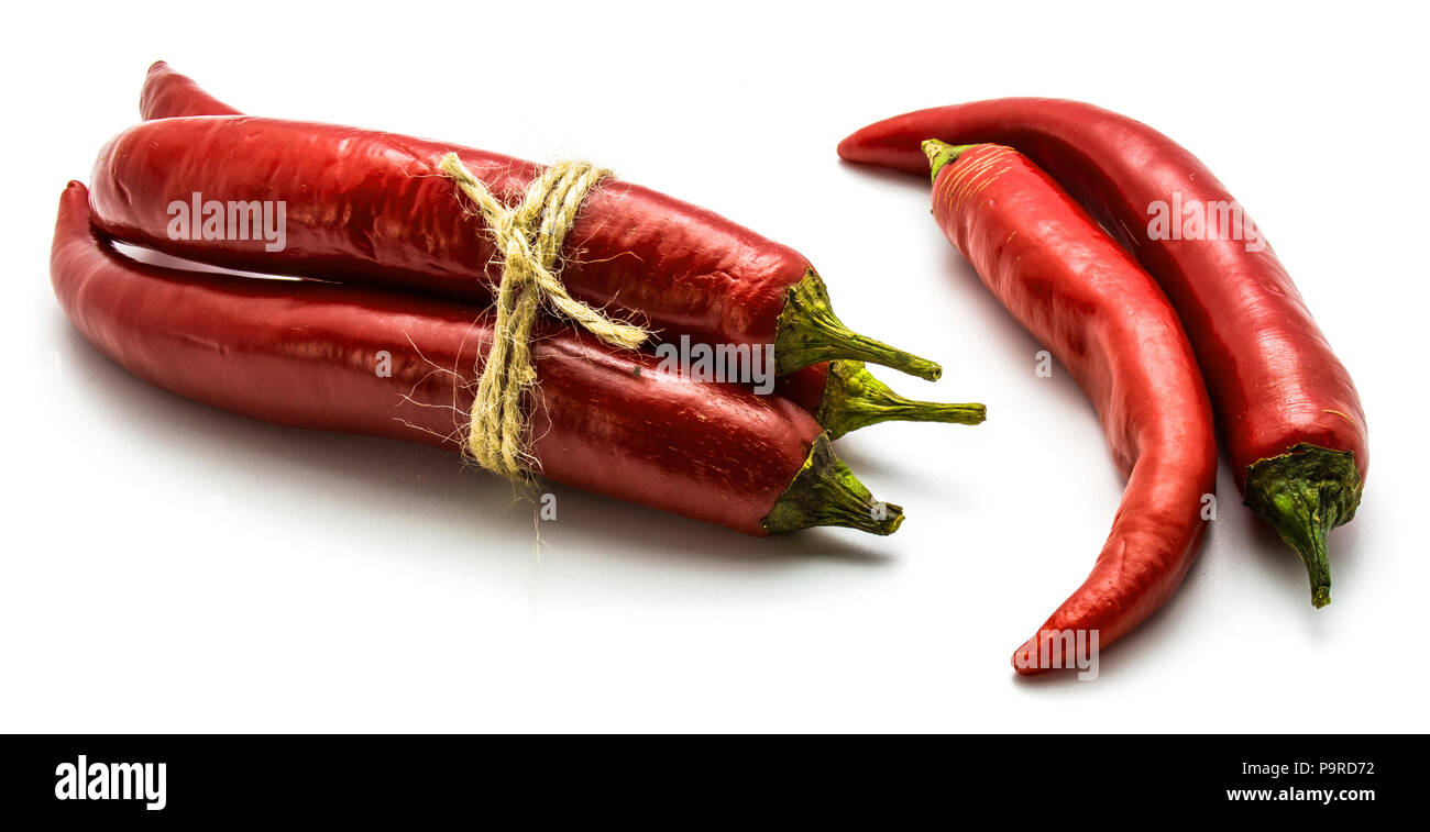 Red Chili peppers tied with a rope isolated on white background Stock ...