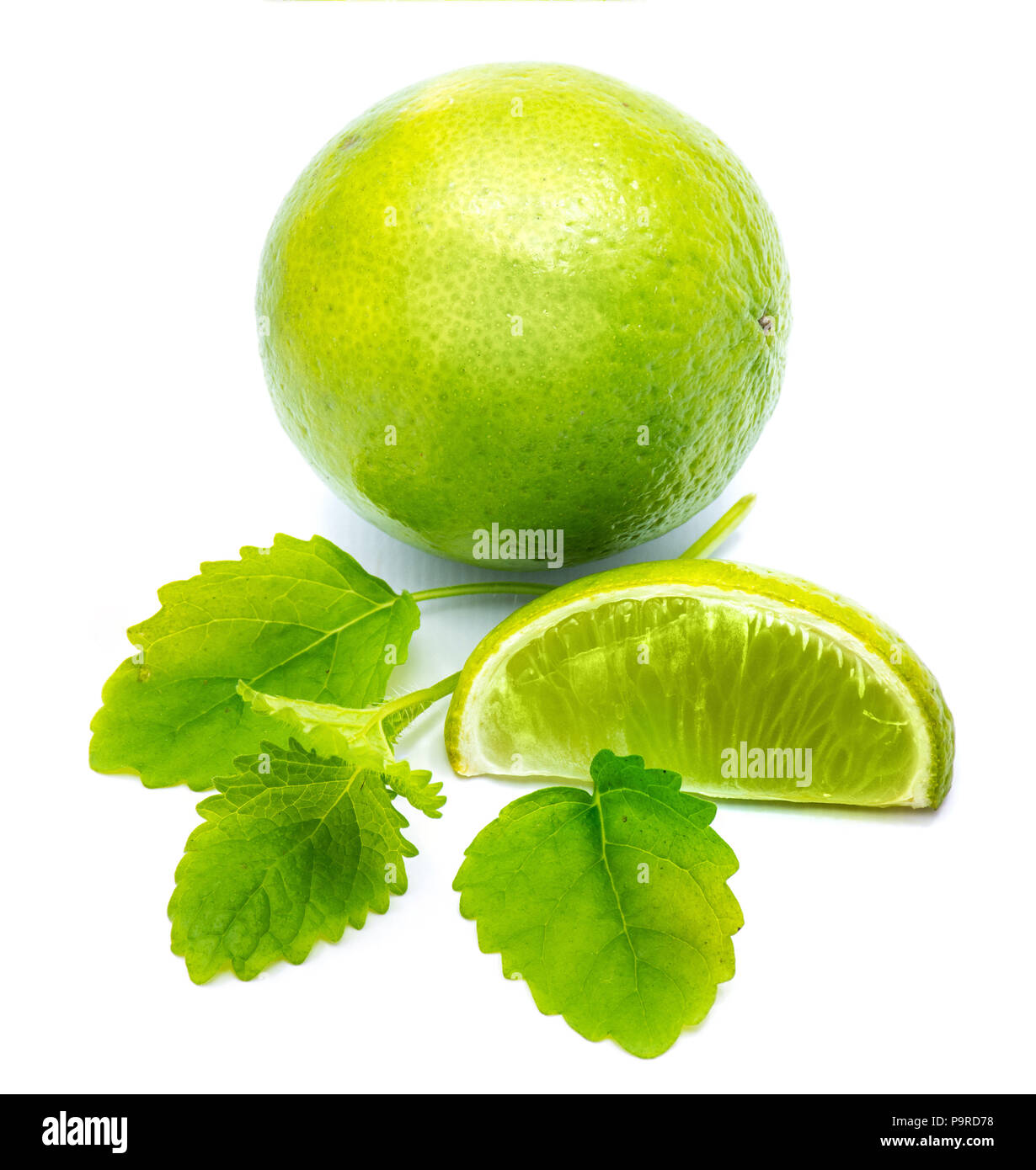 One whole slice and fresh green lemon balm leaves isolated on white background Stock Photo - Alamy
