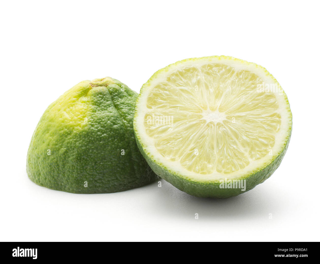 Lime two slice halves isolated on white background section Stock Photo ...