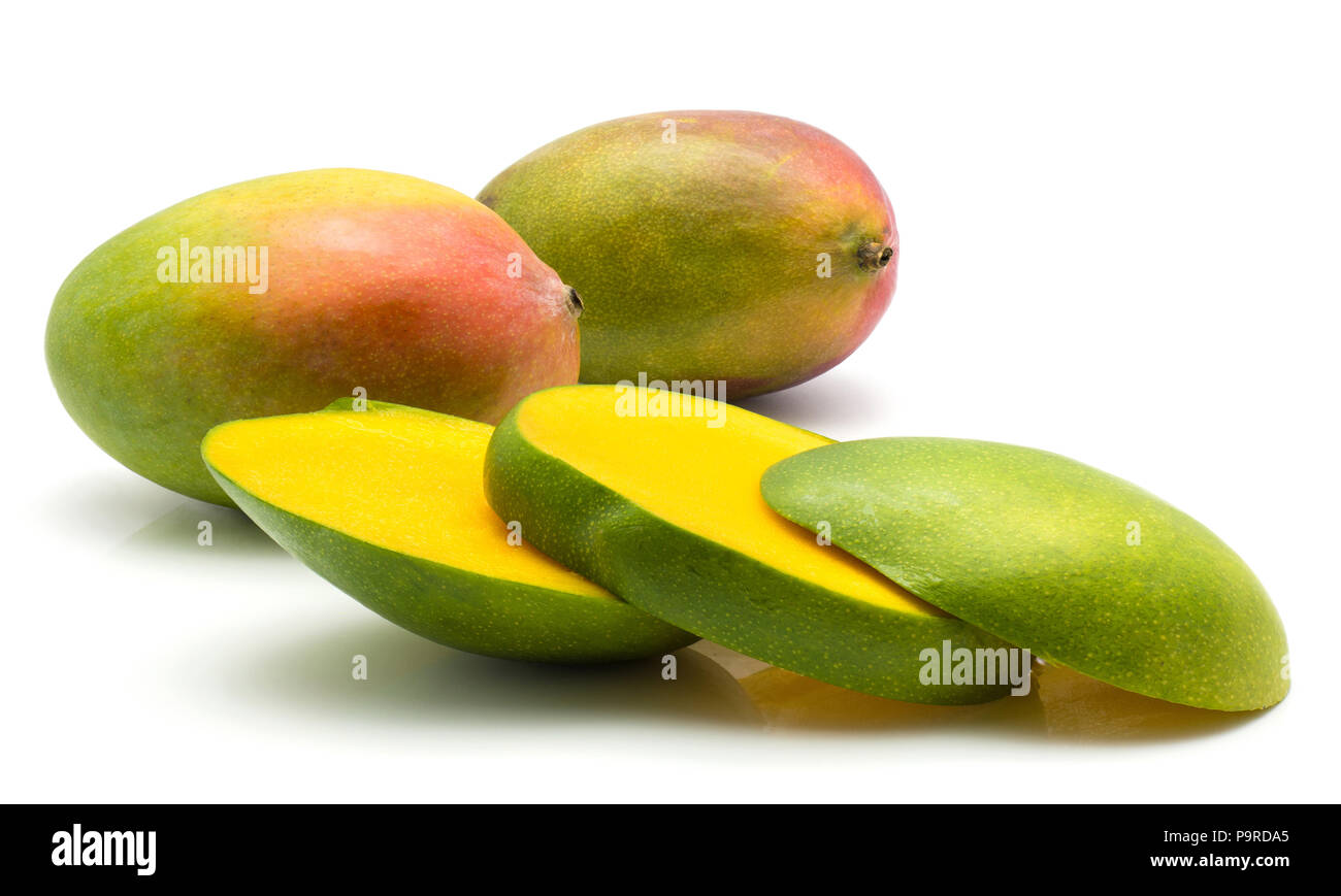 Sliced mango isolated on white background two whole and three slices ...