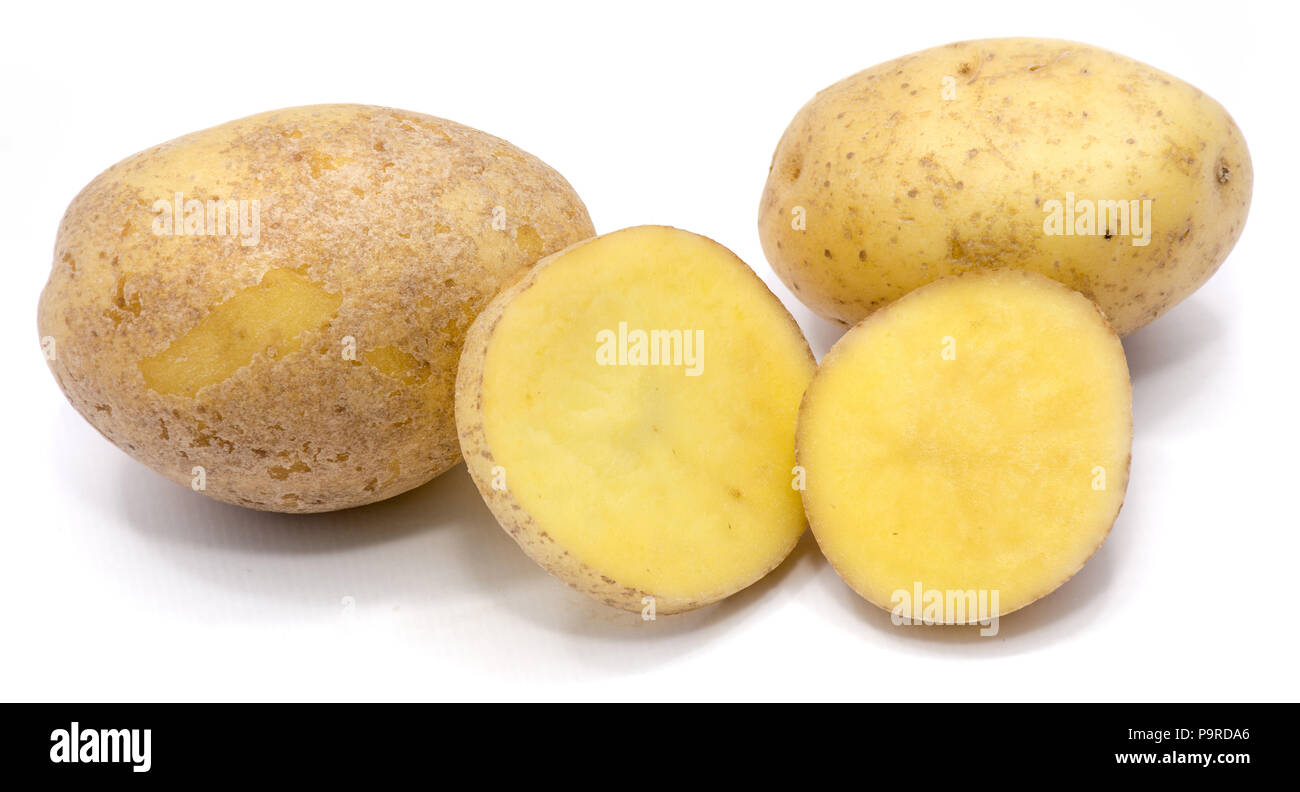 Two whole potatoes and halves isolated on white background Stock Photo ...