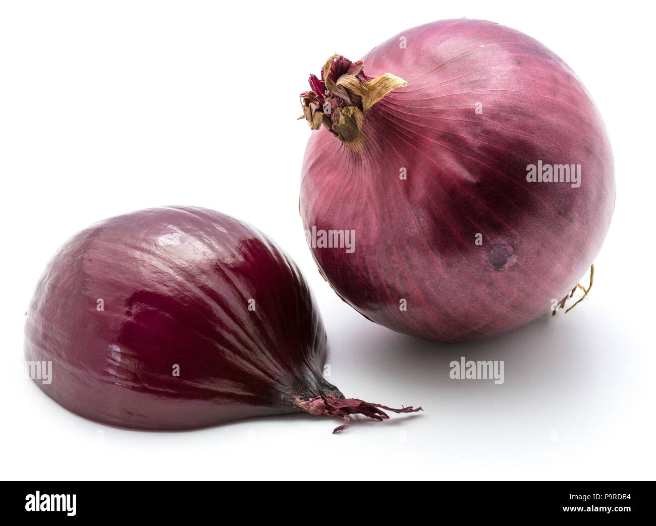 One whole red onion bulb and a half isolated on white background Stock ...