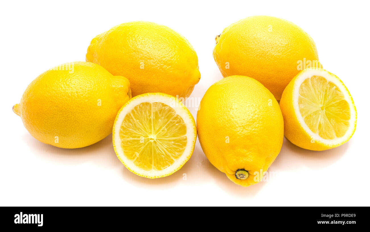 Group of whole yellow lemons and two halves isolated on white ...