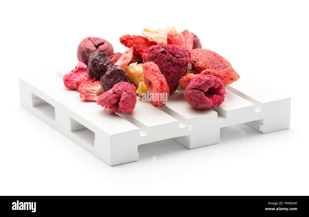 Freeze dried berries mix stack on a pallet isolated on white background ...