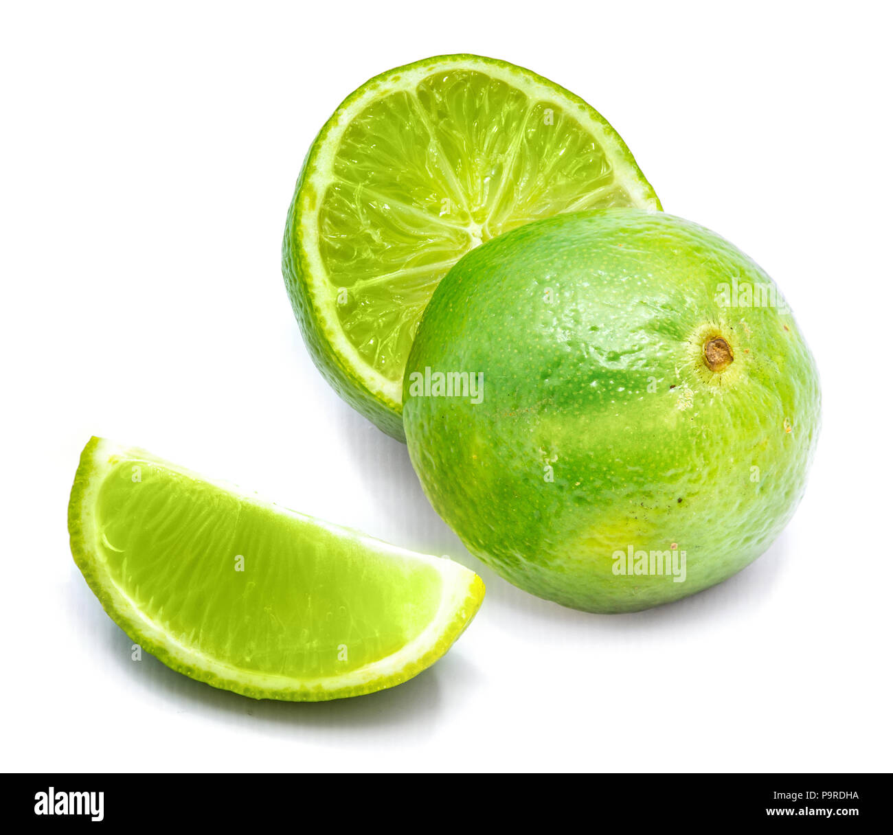 Two lime halves and one slice isolated on white background Stock Photo ...