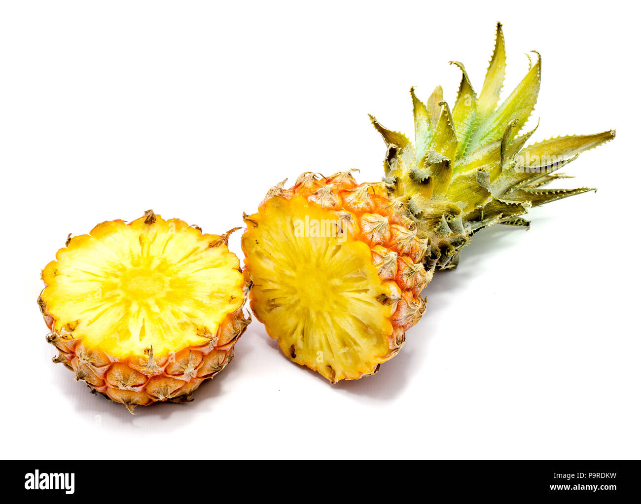 Two pineapple halves isolated on white background Stock Photo - Alamy