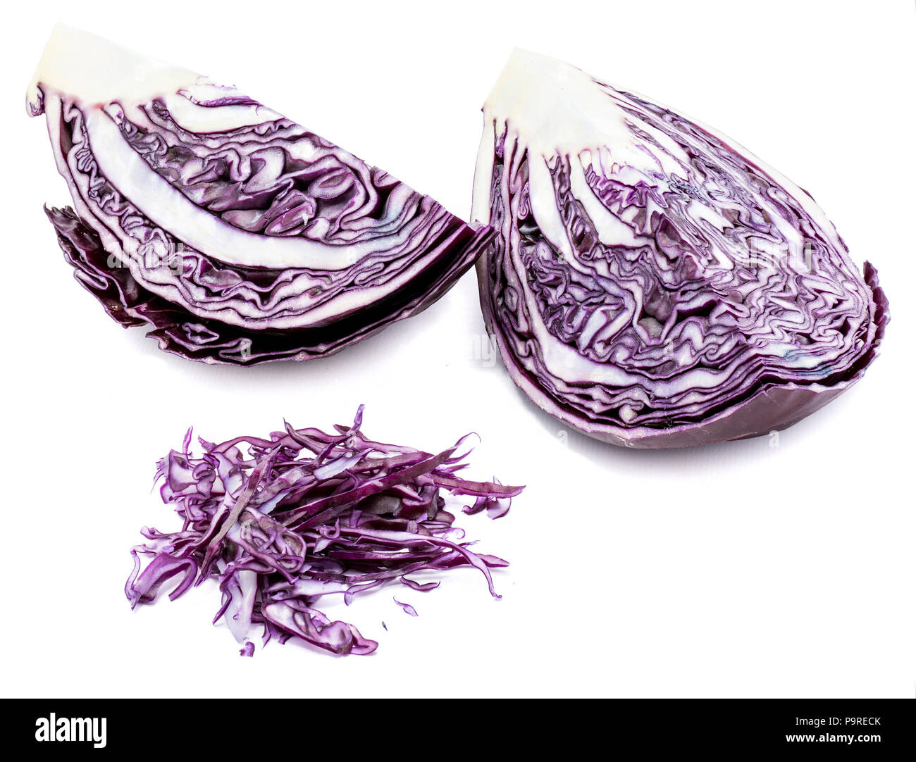 Sliced purple cabbage, two quarters and shredded or chopped heap ...