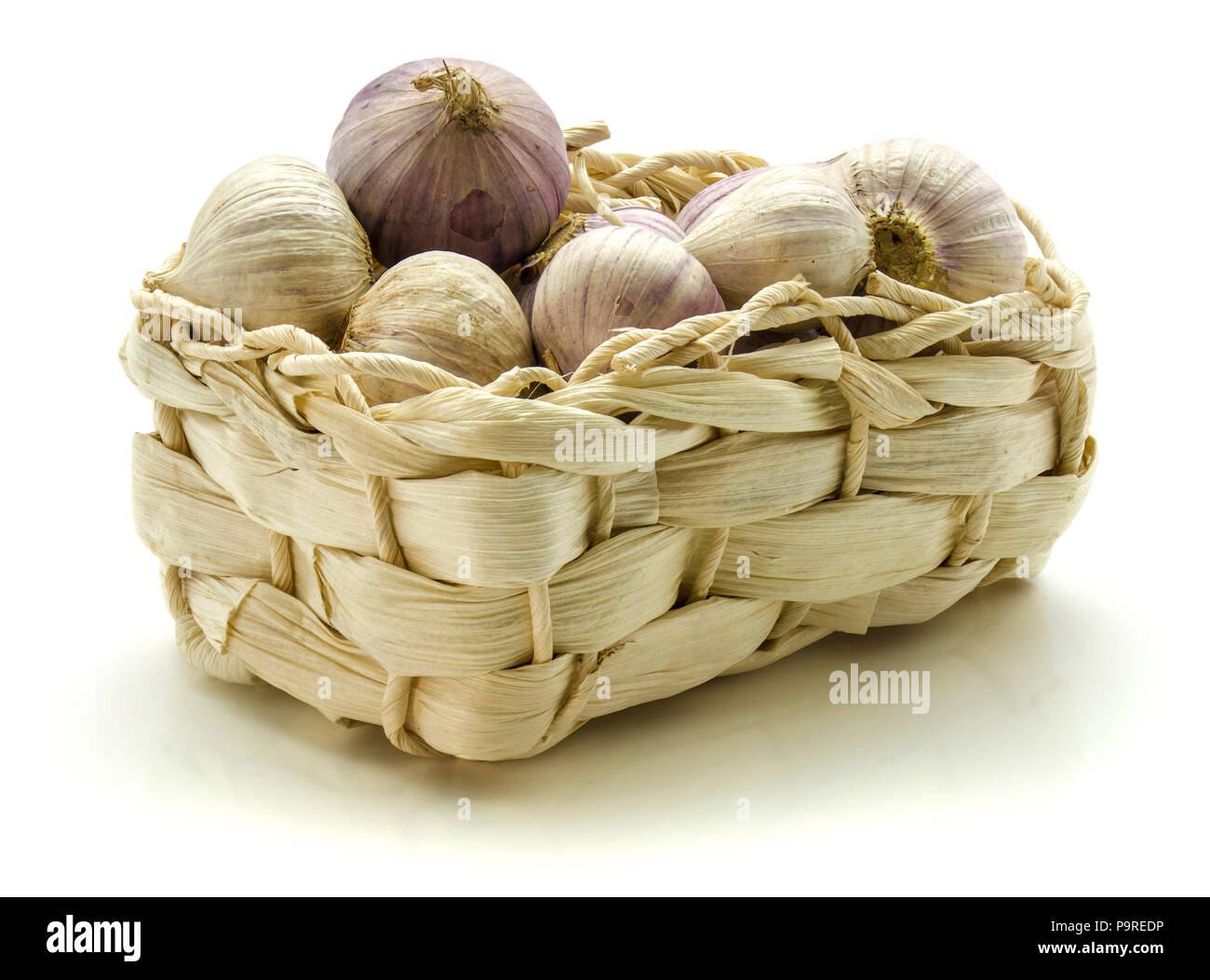 Full straw basket of solo garlic isolated on white background Stock ...