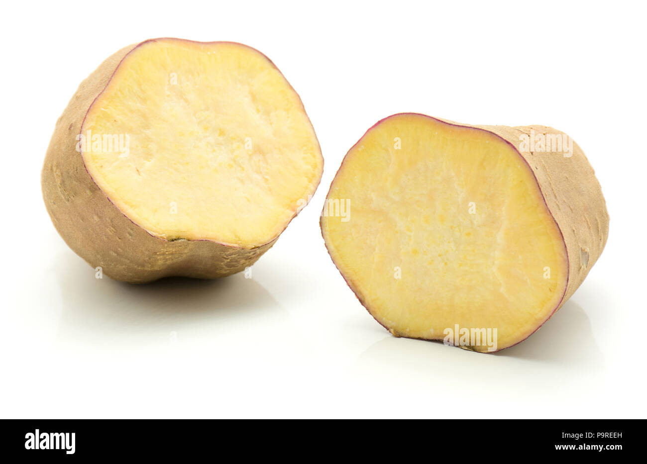 Sliced sweet potato isolated on white background one cut in two halves ...