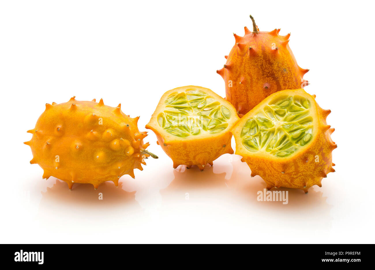 Kiwano isolated on white background two whole and one cut in half Stock ...