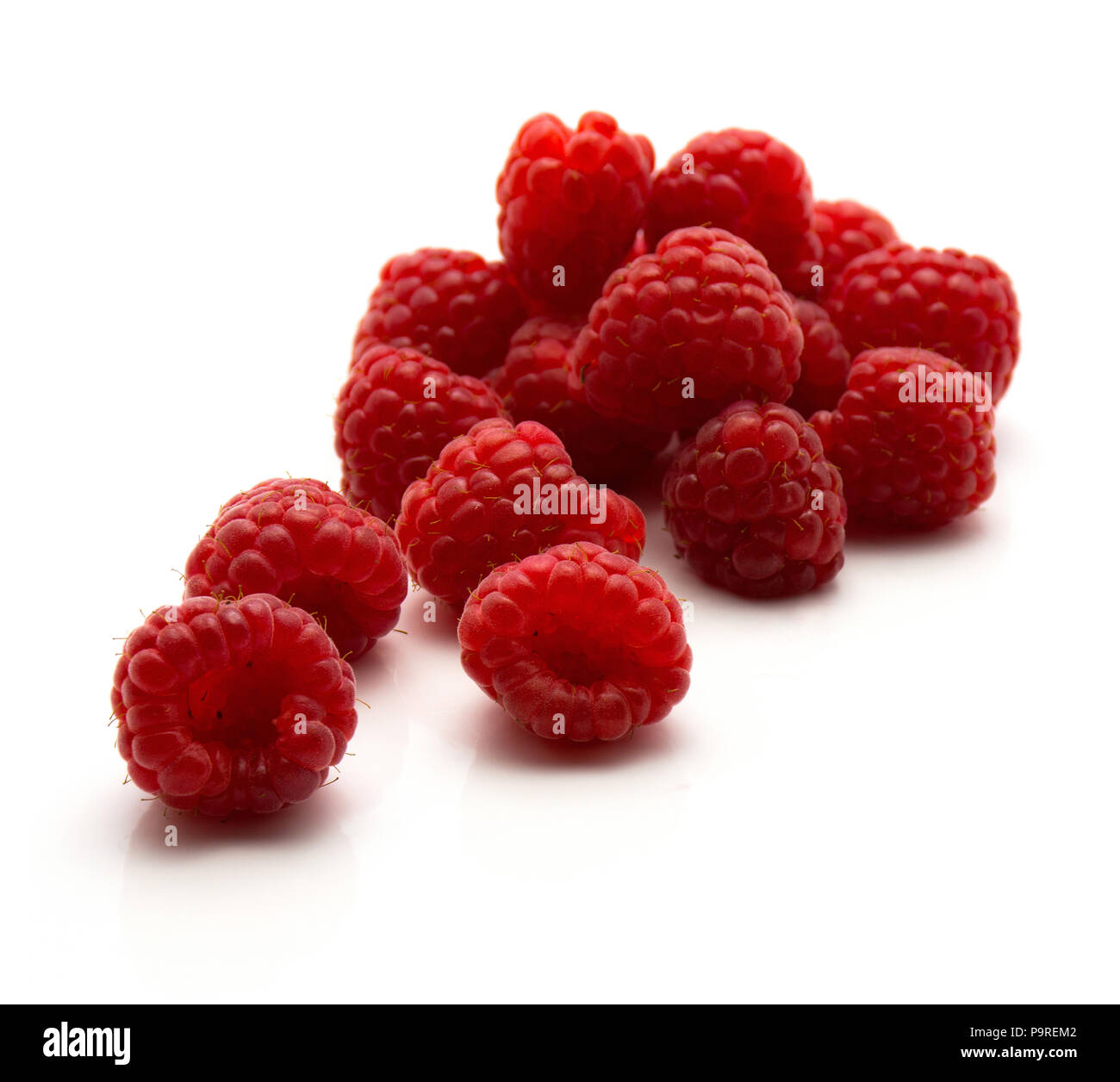 Red raspberries isolated on white background fresh heap Stock Photo - Alamy