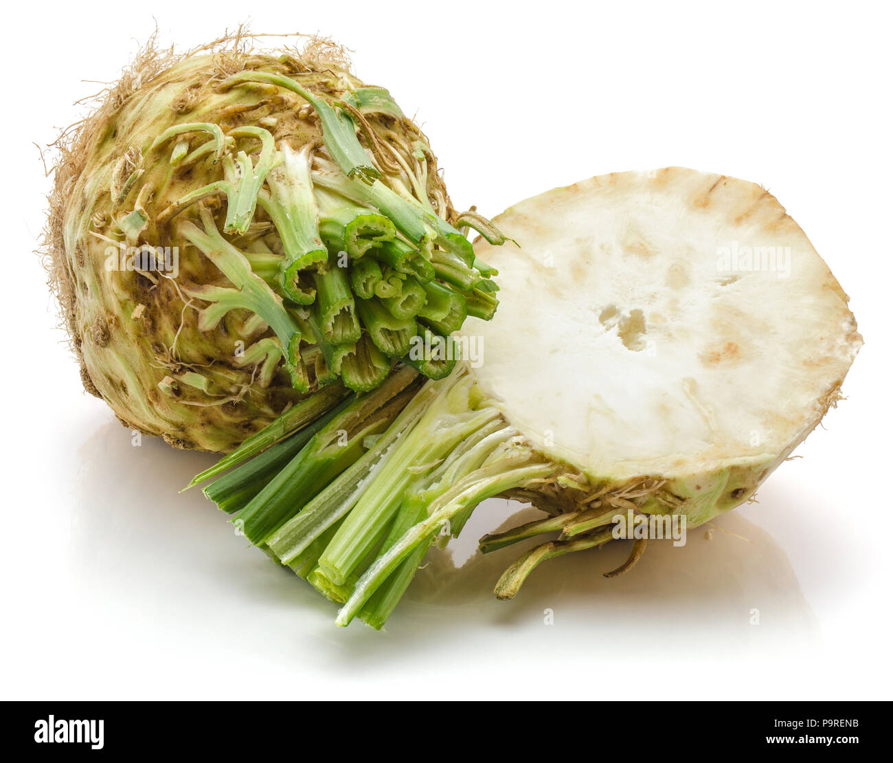 One whole and half of fresh celery root isolated on white background ...