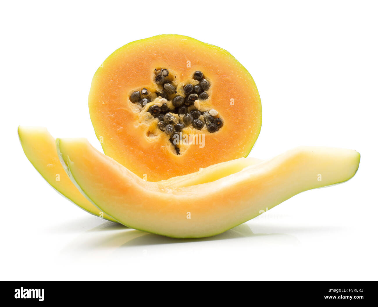 Green papaya (pawpaw, papaw) one half and two slices without seeds ...