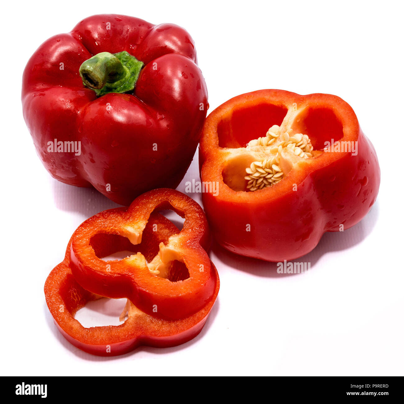 Group of peppers, red pepper slices, red cut piece of pepper and whole ...