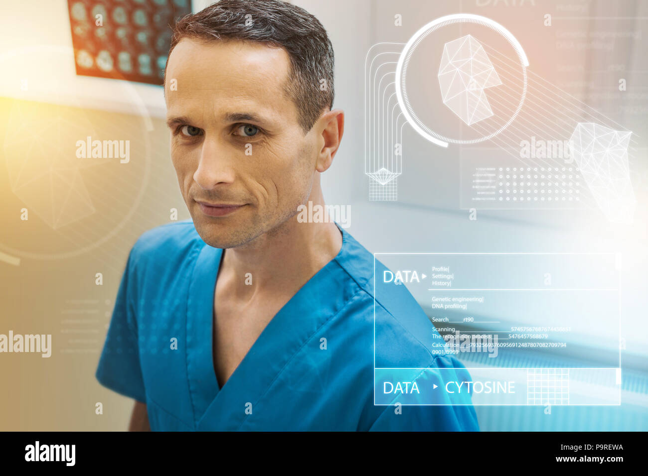 Medical worker. Calm handsome qualified doctor in blue clothes feeling ...