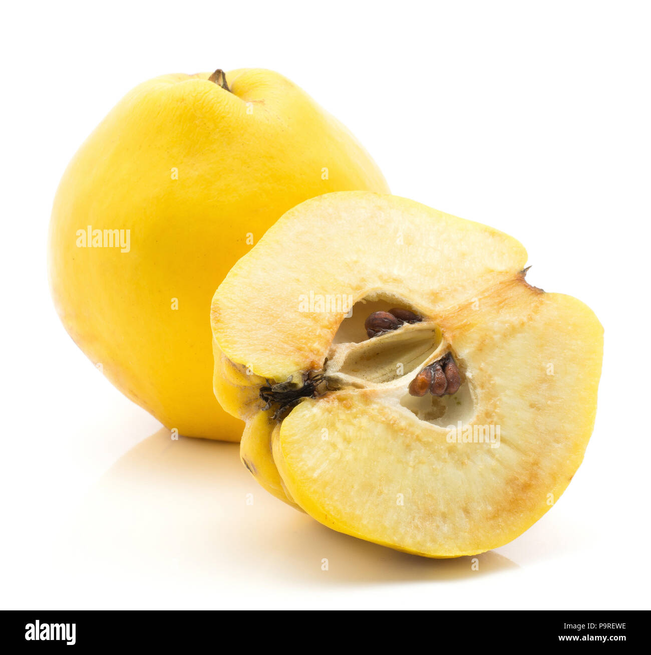 Yellow quince isolated on white background raw ripe one whole and one ...