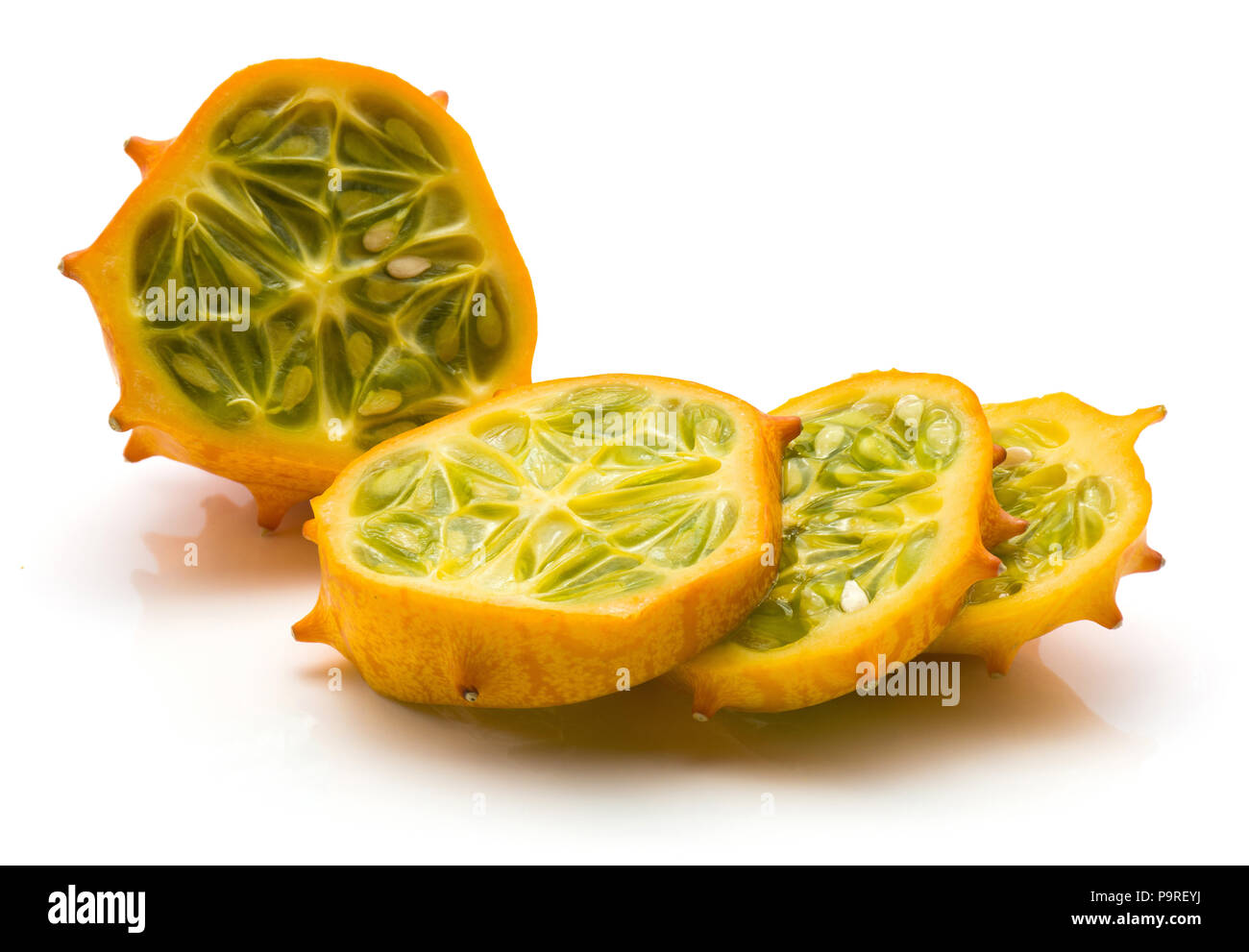 Three kiwano slices and one half isolated on white background Stock ...
