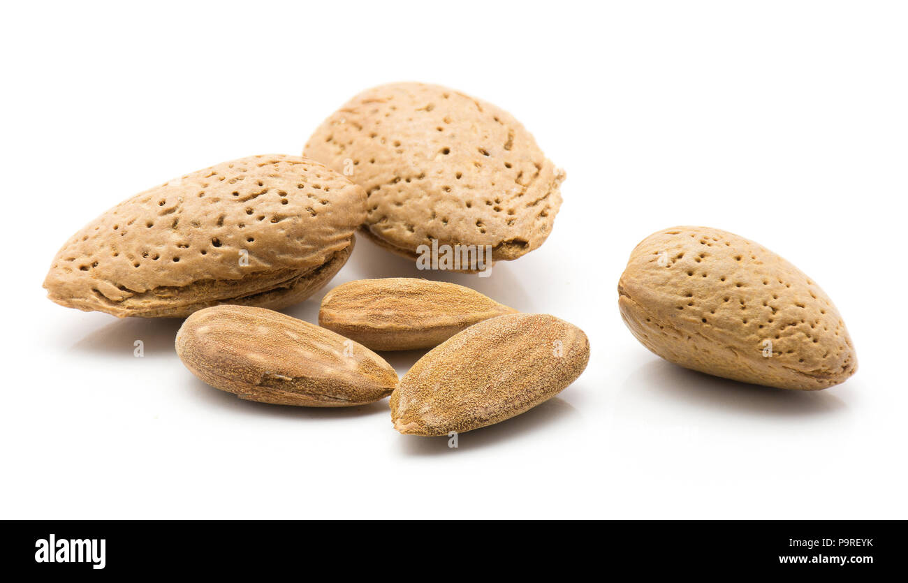 Almonds three shelled nuts and unshelled isolated on white background ...