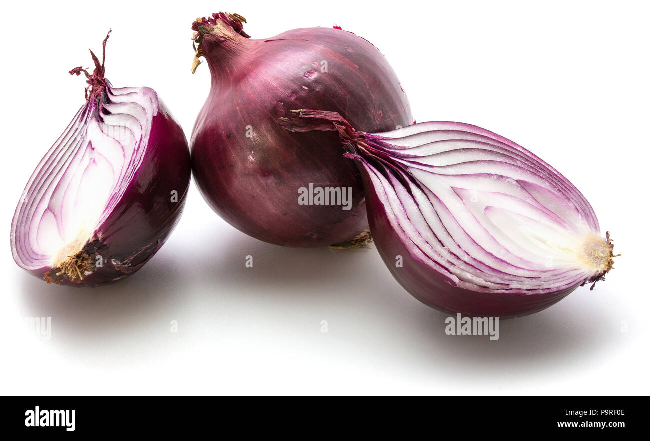 One whole red onion bulb and two halves isolated on white background ...