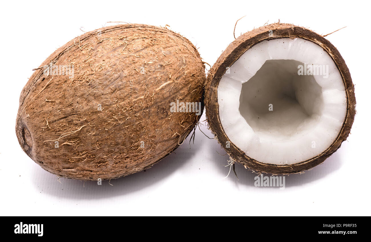 One whole coconut and one half isolated on white background Stock Photo ...