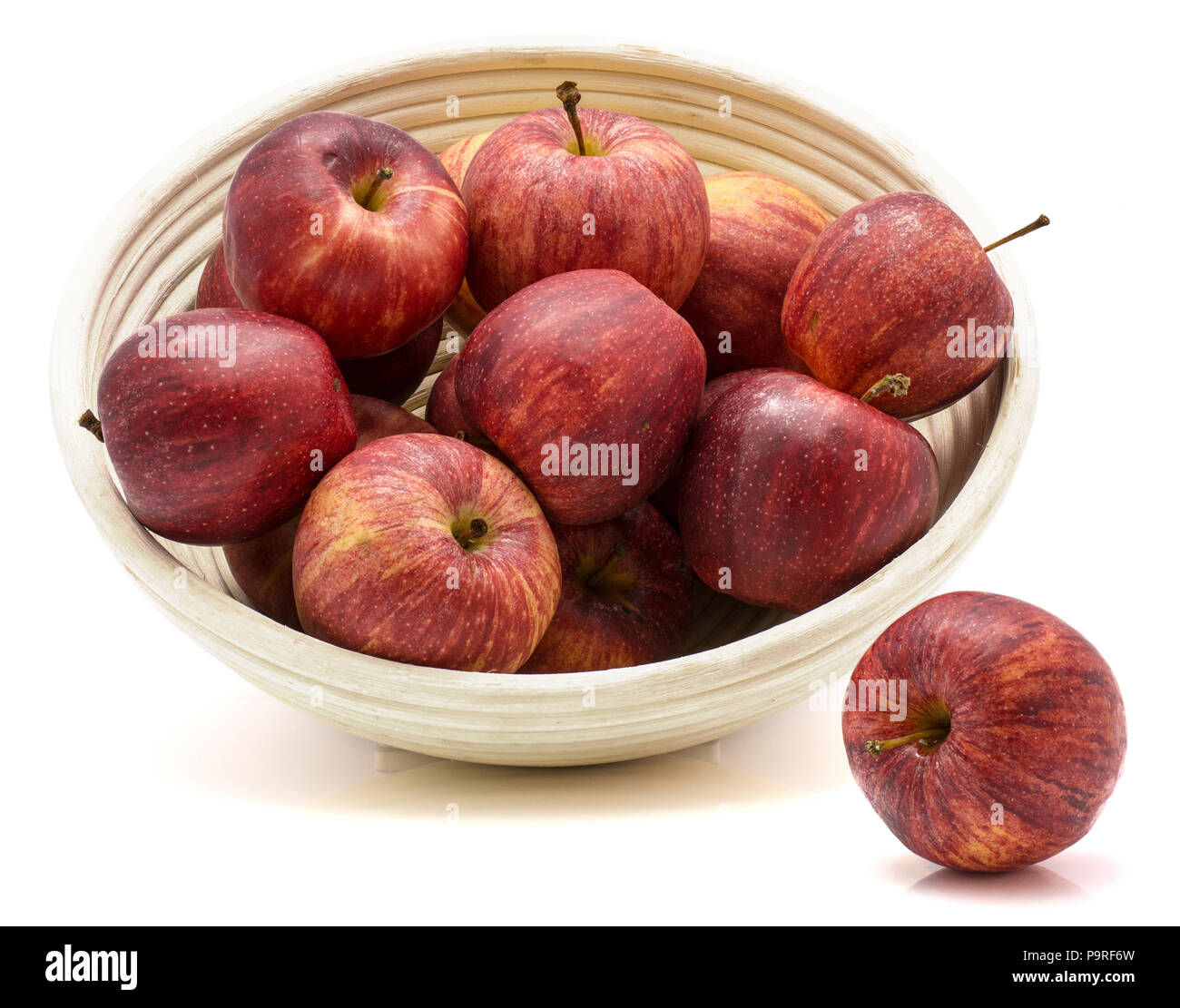 Gala apples in rattan bowl isolated on white background one apple is ...