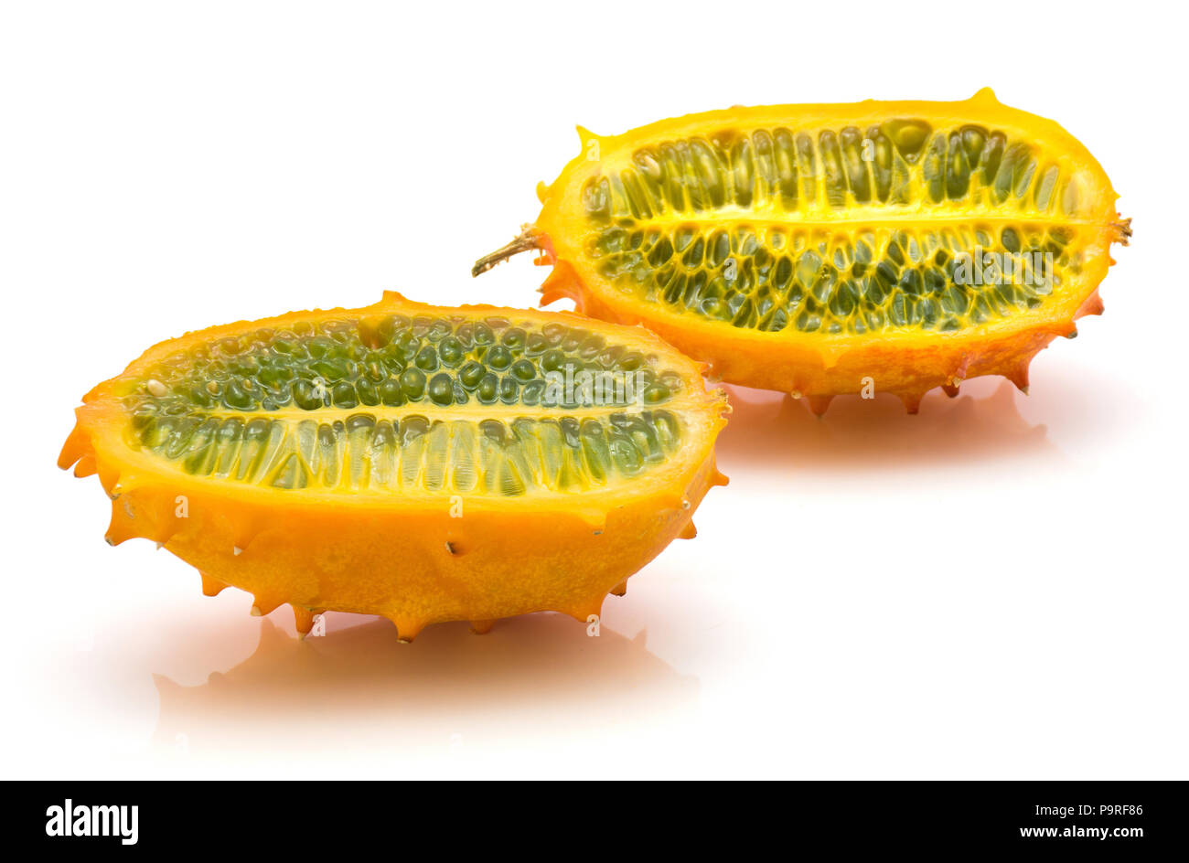 Sliced kiwano isolated on white background two halves cross section ...