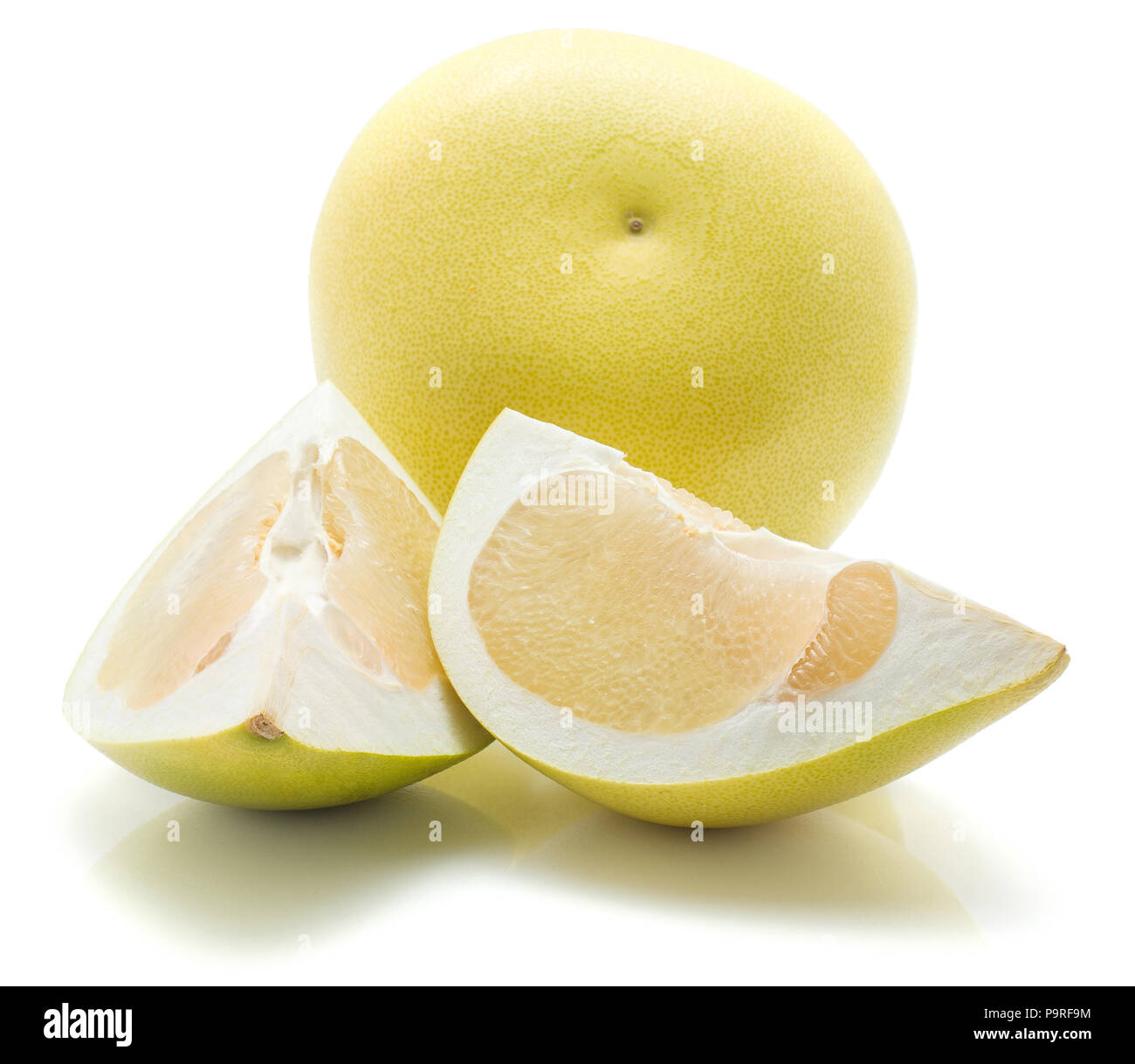 One pamelo with two slices isolated on white background yellow pale ...
