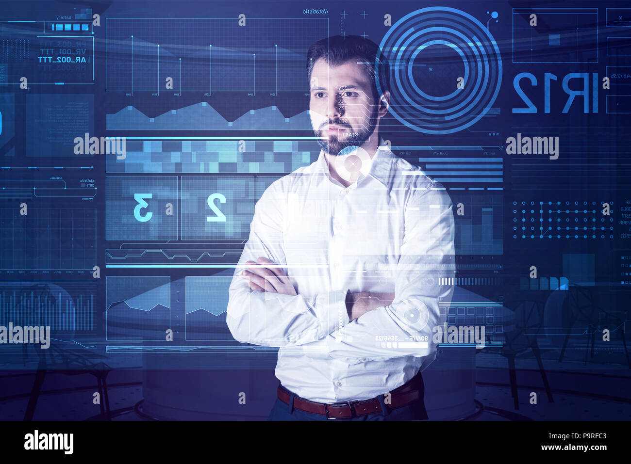 Calm software developer. Thoughtful young software developer standing ...