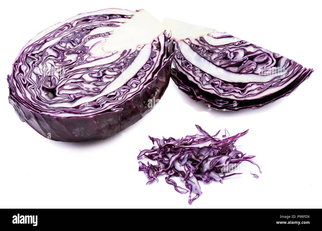 Group of sliced purple cabbage, one half, two quarters and shredded or ...