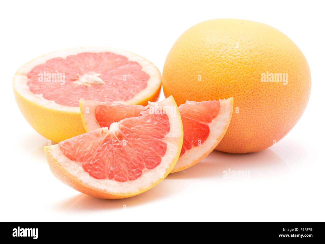 Two red grapefruit slices, one half and one whole isolated on white ...