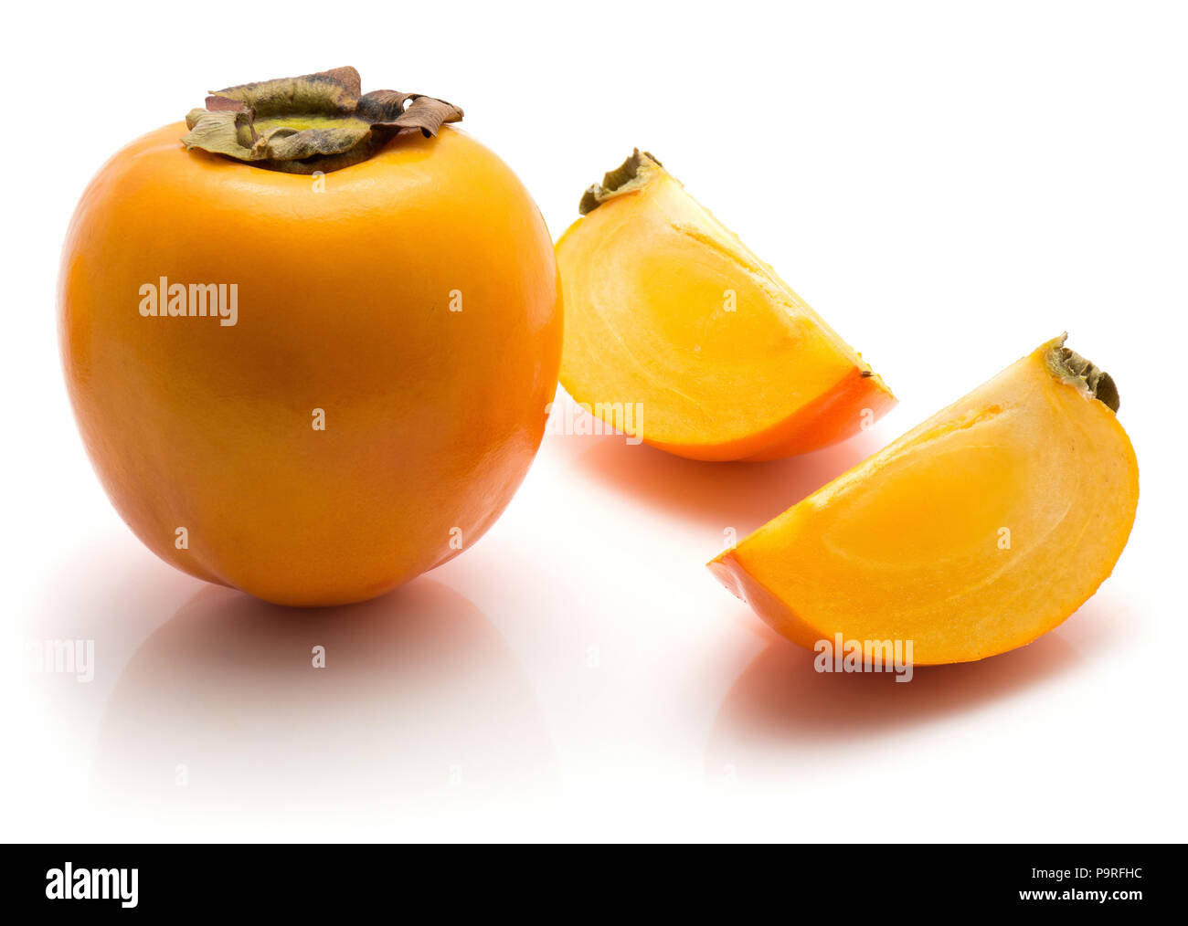 Sliced persimmon Kaki isolated on white background one whole two slices ...