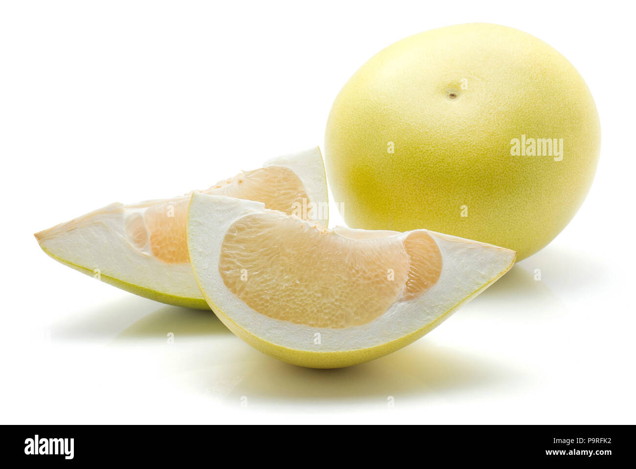 Pamelo isolated on white background one whole pale green yellow and two ...
