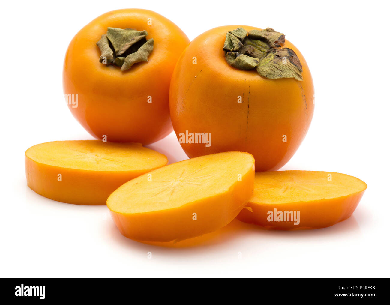 Sliced persimmon Kaki isolated on white background two whole three ...