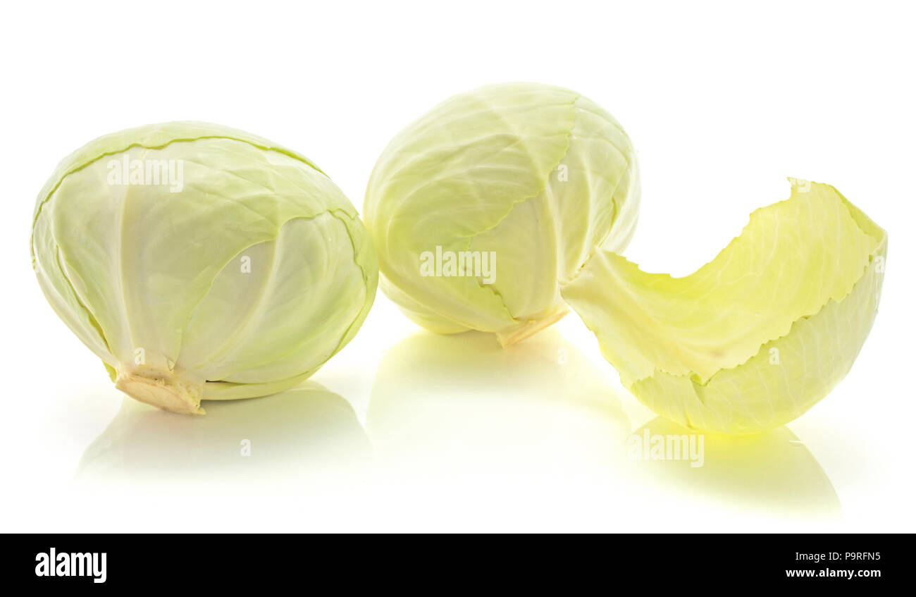 Two white cabbages with separated leaf isolated on white background ...