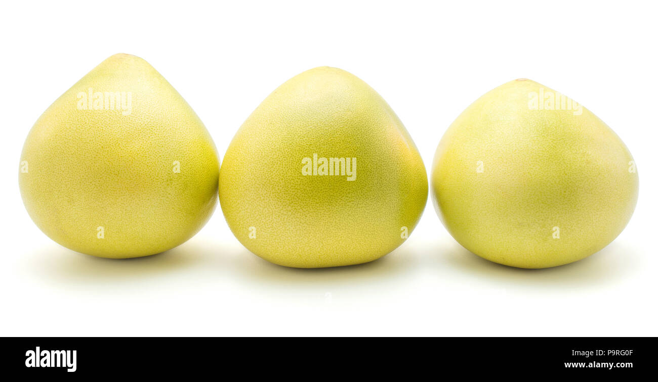 Three yellow pamelo in row isolated on white background Stock Photo - Alamy