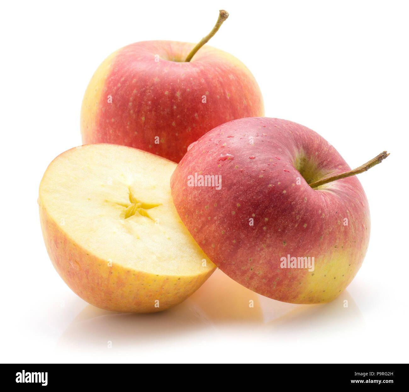 Apples (Evelina variety) isolated on white background one whole and one ...