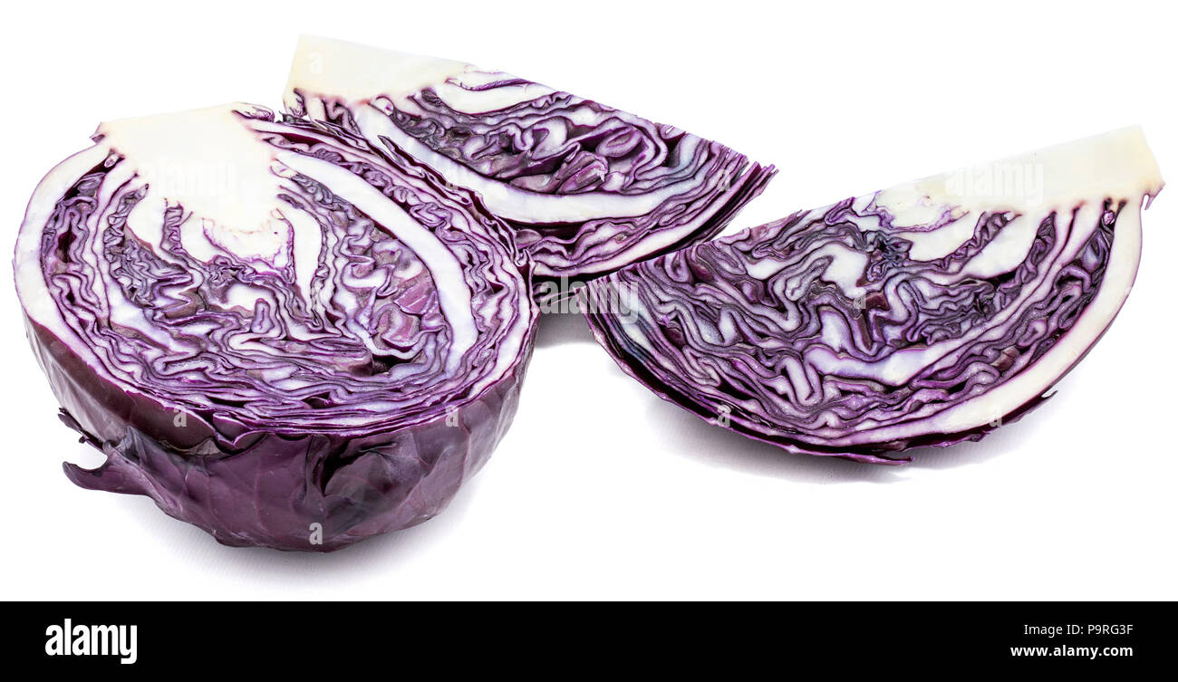 Two sliced quarters of purple cabbage and one half isolated on white ...