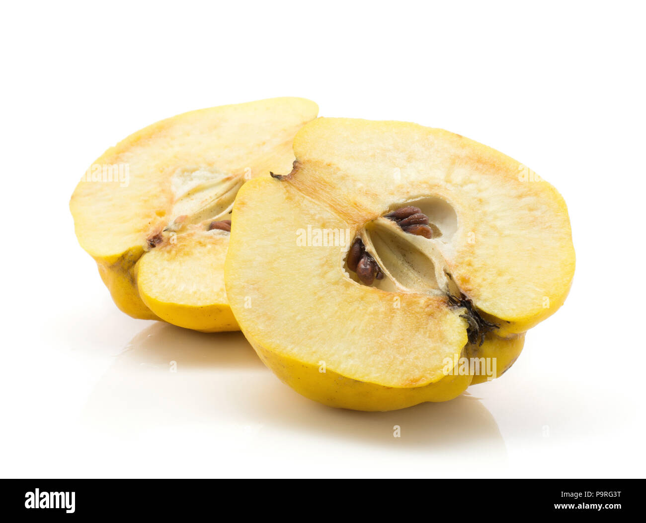 Yellow quince two halves with seeds isolated on white background raw ...