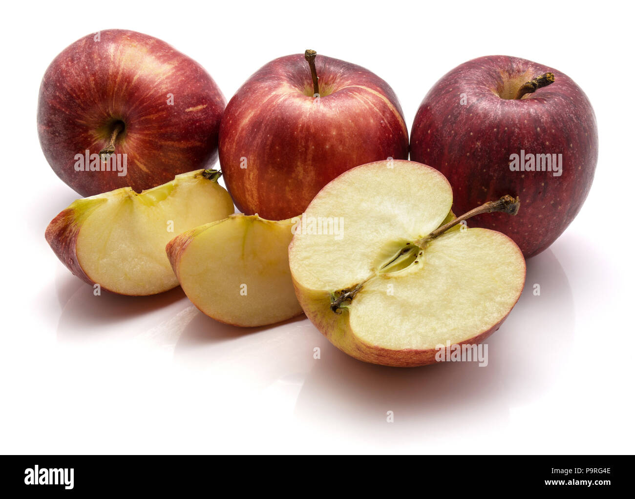 Gala apples, three whole, two slices, one half, isolated on white ...